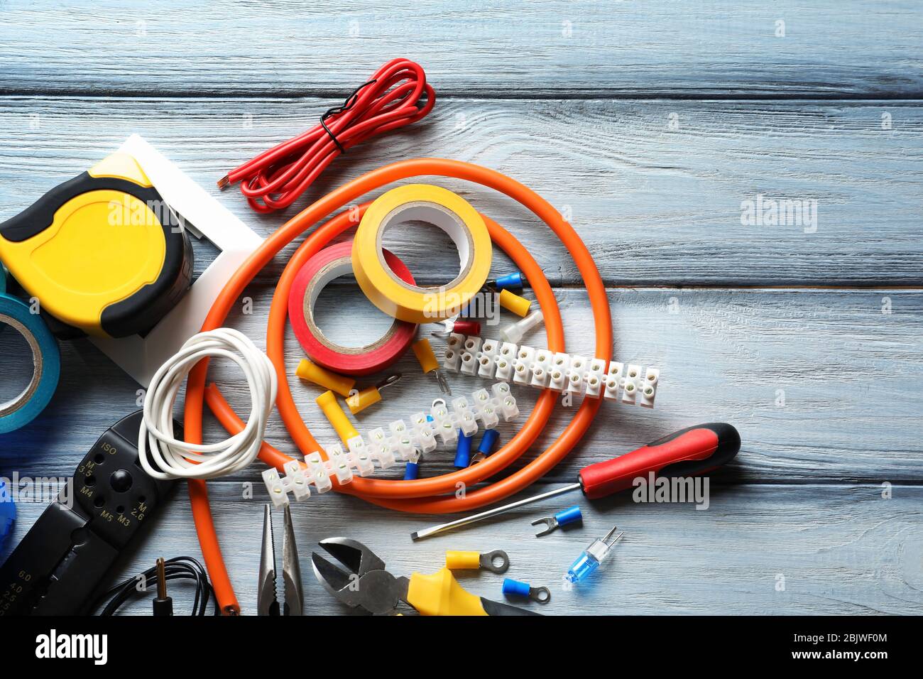 Different electrical tools on wooden background Stock Photo - Alamy