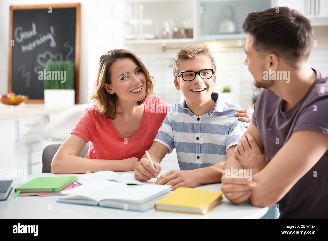 Parents child homework glasses hi-res stock photography and images - Alamy