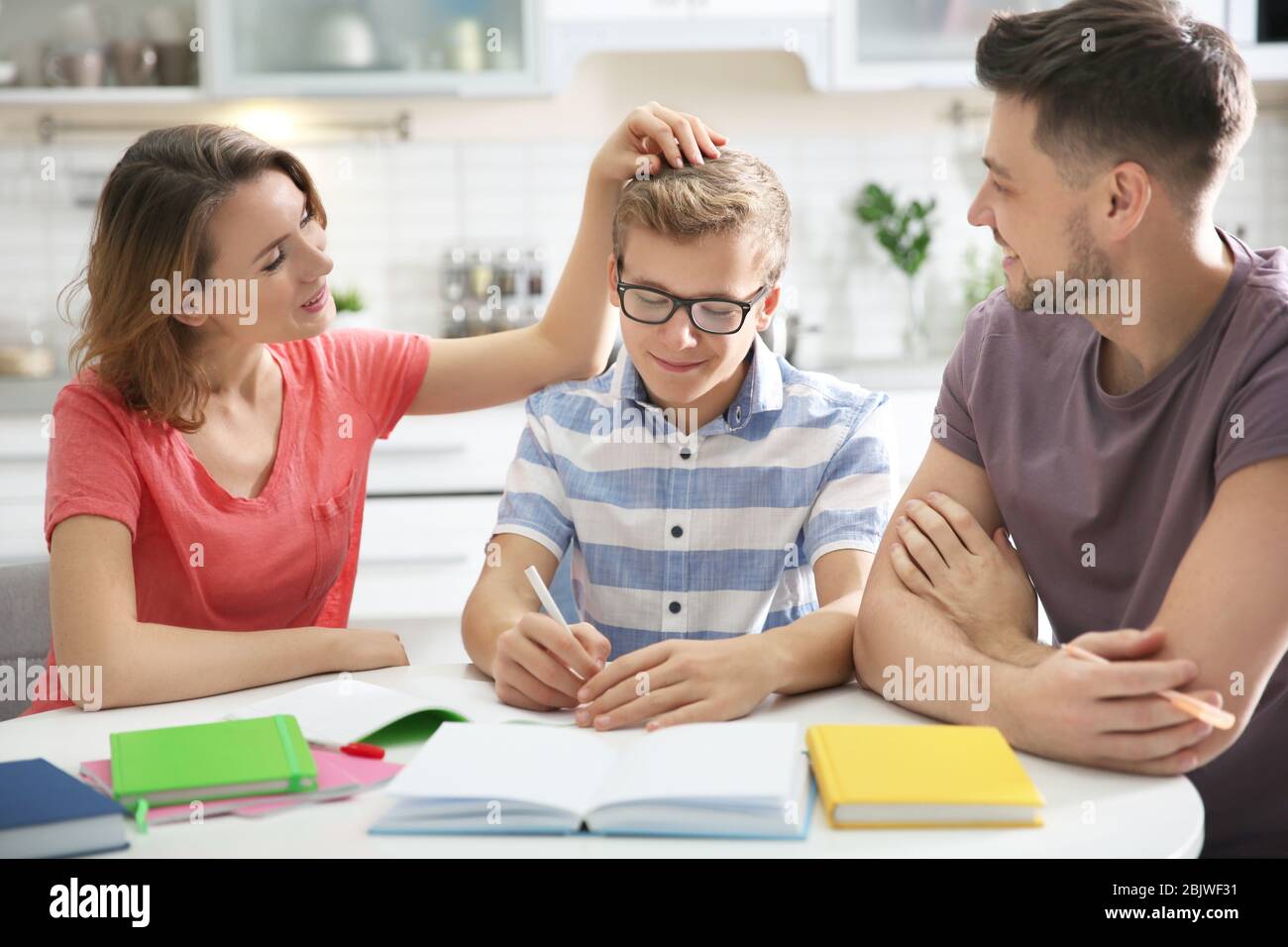 Parents child homework glasses hi-res stock photography and images - Alamy