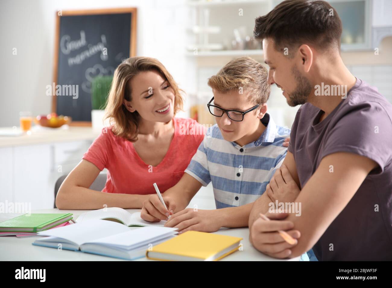 Parents child homework glasses hi-res stock photography and images - Alamy