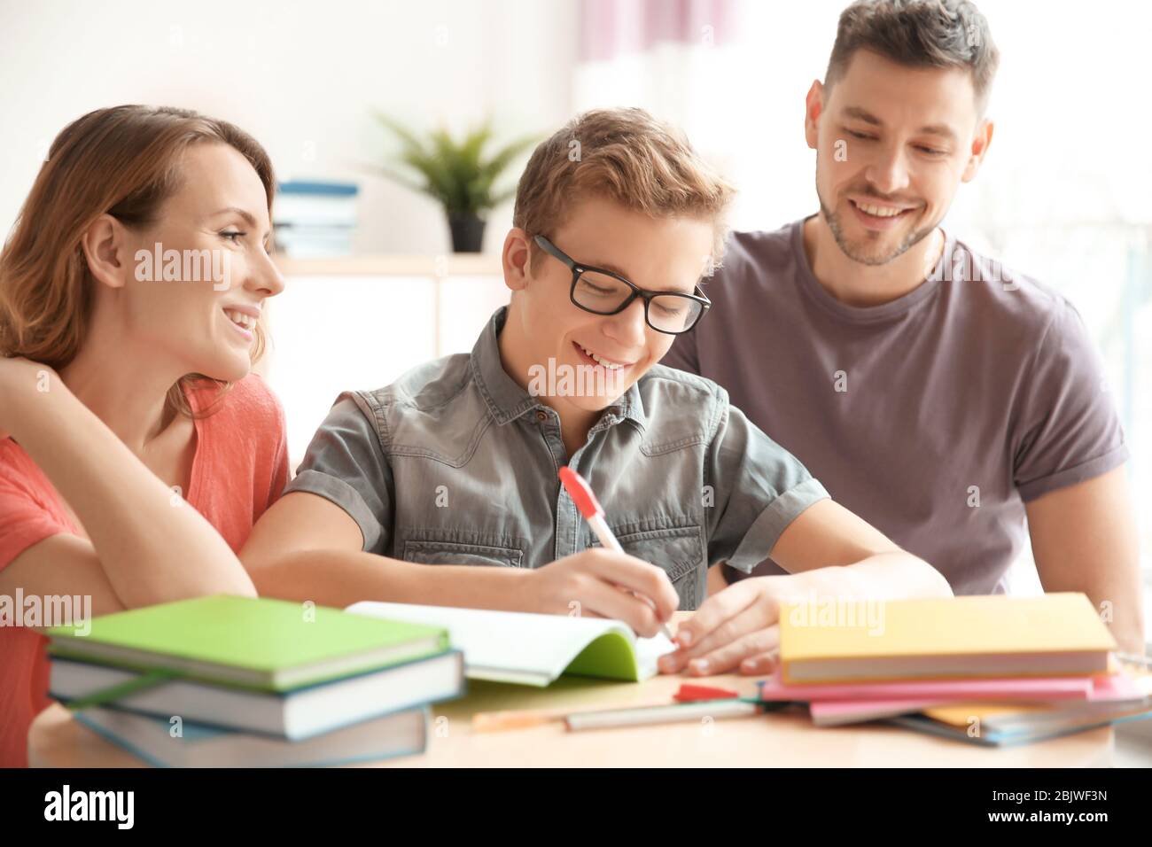 Parents child homework glasses hi-res stock photography and images - Alamy