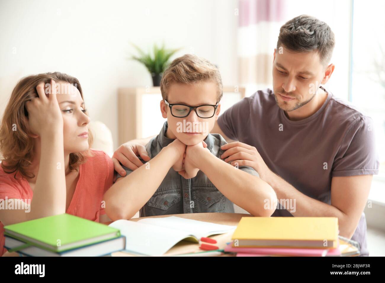 Parents child homework glasses hi-res stock photography and images - Alamy