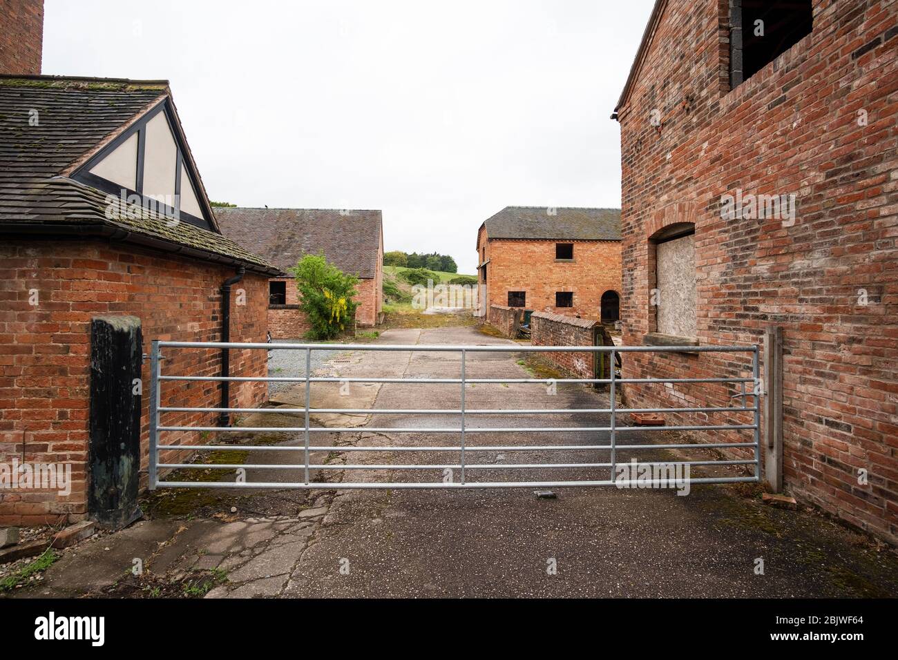 Old village buildings in a gated community Stock Photo - Alamy