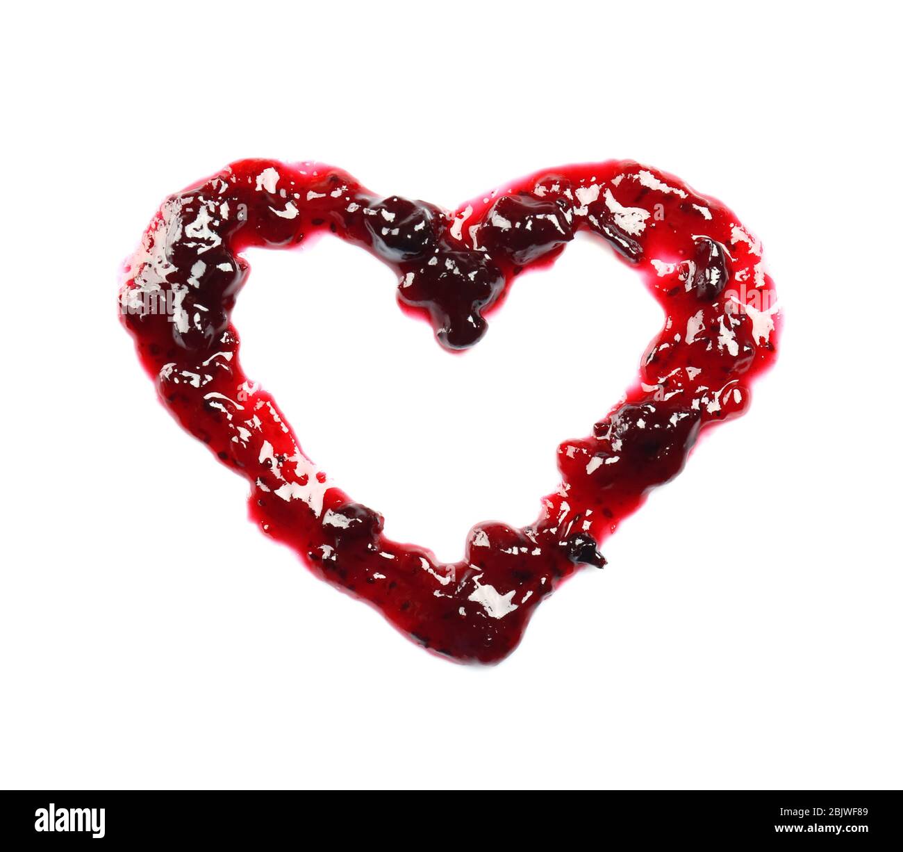 Heart shape made of sweet jam on white background Stock Photo - Alamy