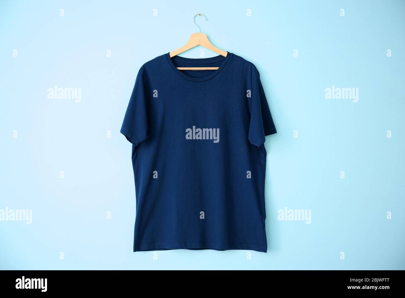 Color t-shirt on light background. Mockup for design Stock Photo - Alamy