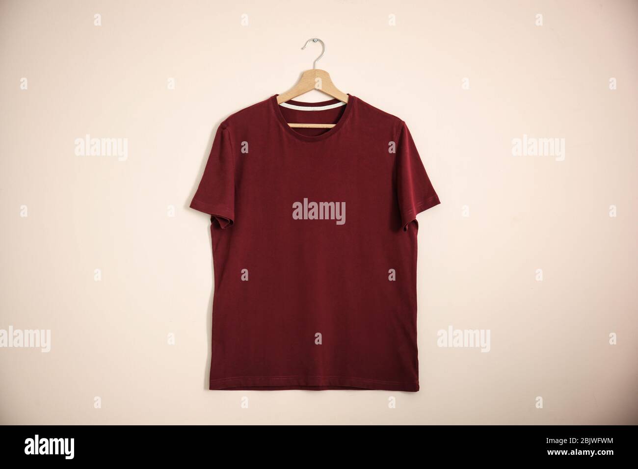Color t-shirt on light background. Mockup for design Stock Photo - Alamy