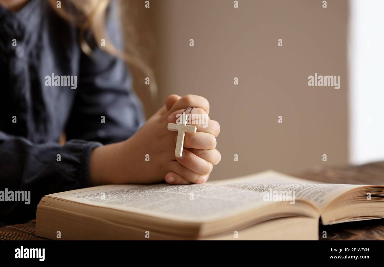 Religious Christian girl praying over Bible indoors Stock Photo - Alamy