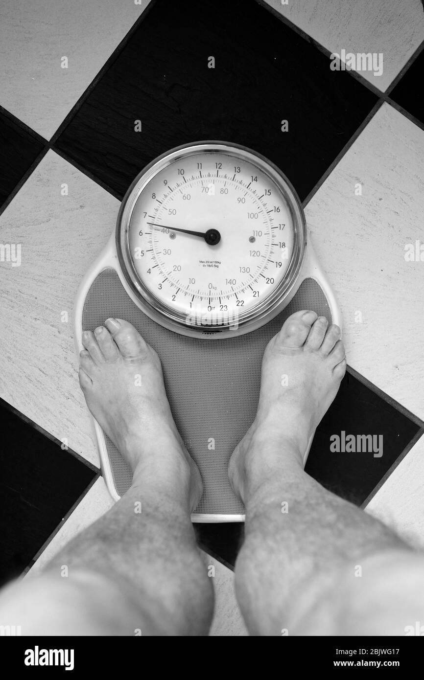 Feet on scales Black and White Stock Photos & Images - Alamy