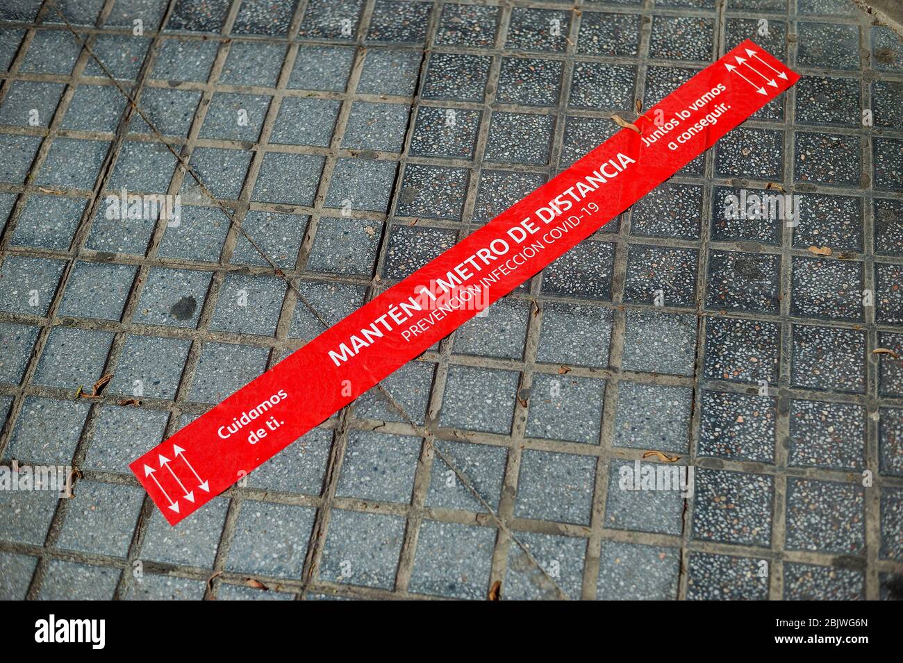 An informative sticker that says Keep 1 metre of distance seen on the ...