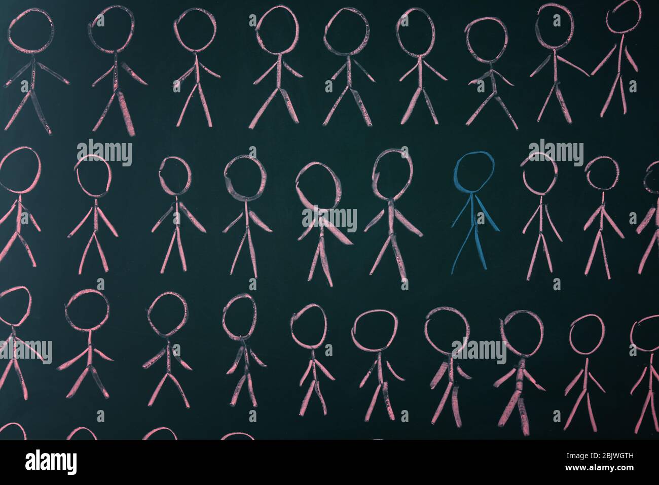 Chalkboard with human figures and one different Stock Photo - Alamy