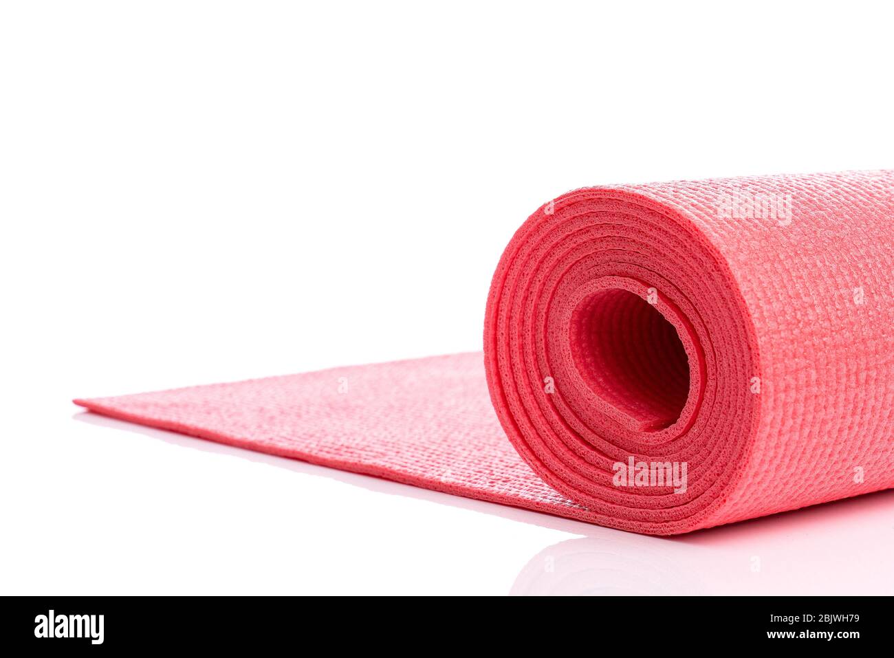 Red yoga mat for exercise isolated on over white background Stock Photo ...