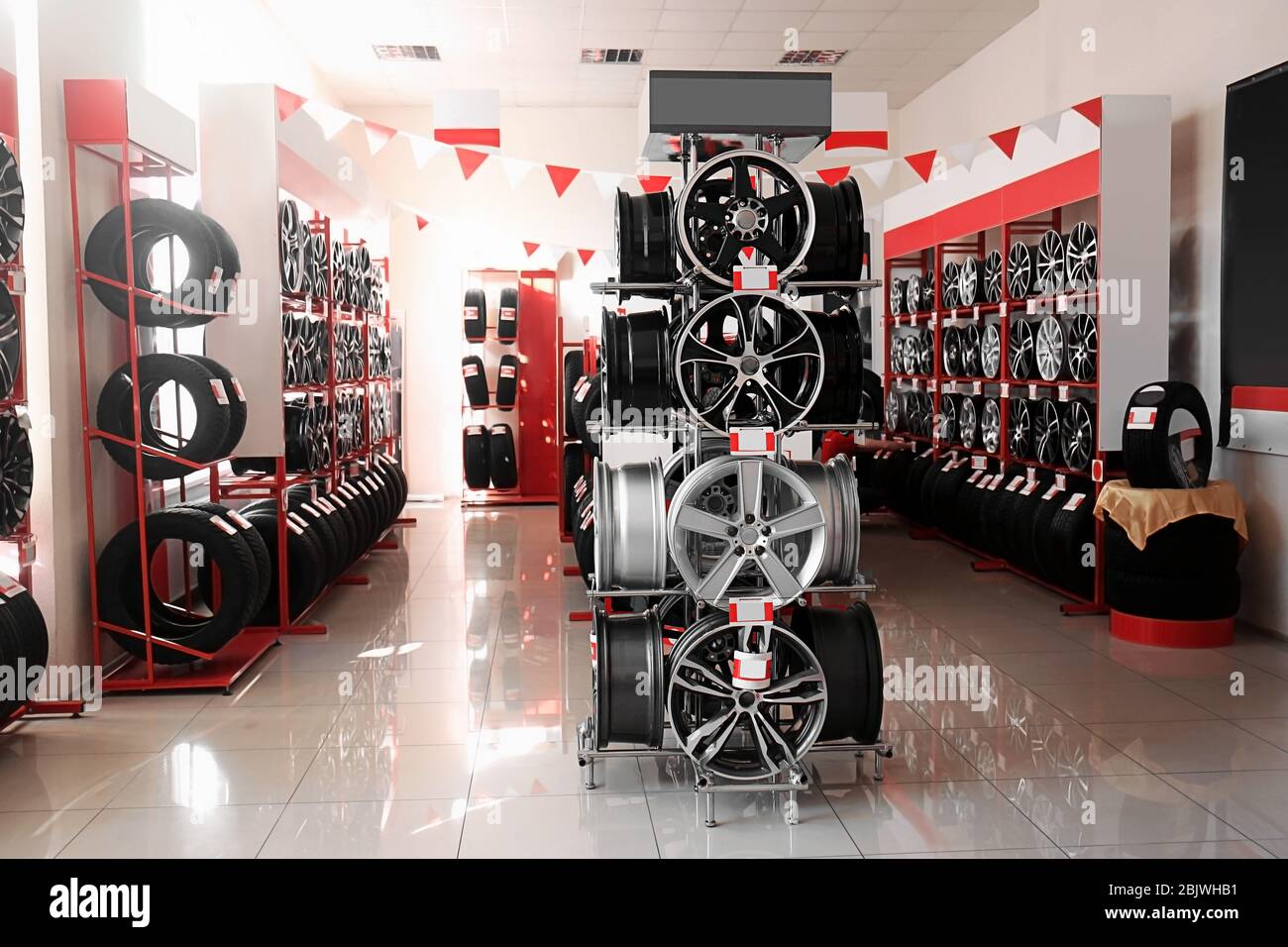 Modern tire store interior Stock Photo - Alamy