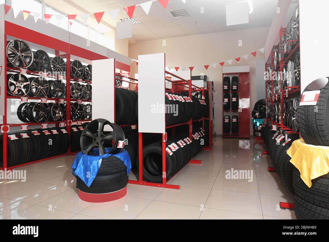 Modern tire store interior Stock Photo - Alamy