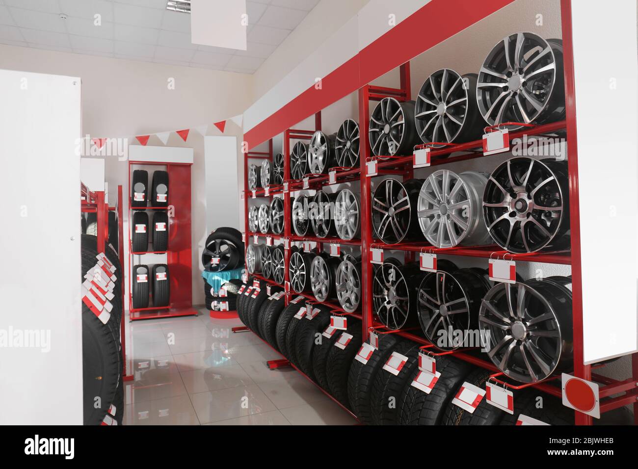 Modern tire store interior Stock Photo - Alamy