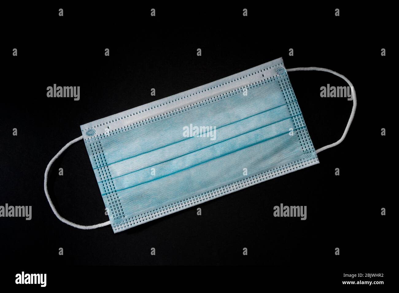 Face masks for virus protection on black background Stock Photo - Alamy