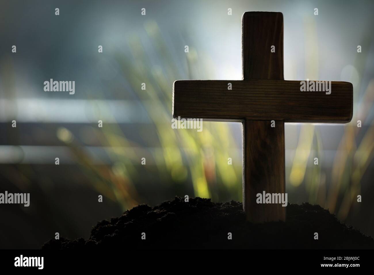 Wooden cemetery cross on blurred background Stock Photo - Alamy
