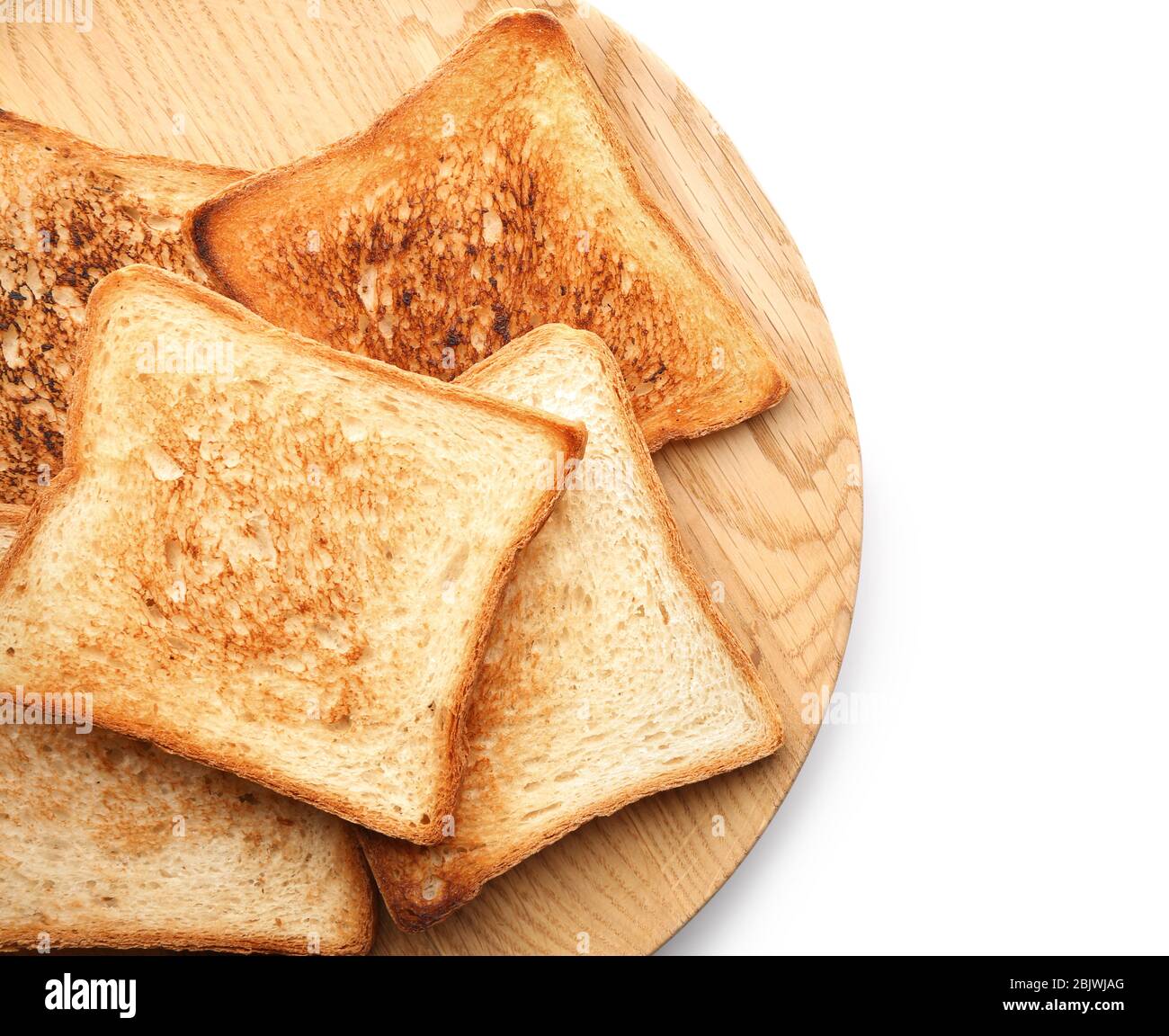 Wooden plate with tasty toasted bread on white background Stock Photo ...