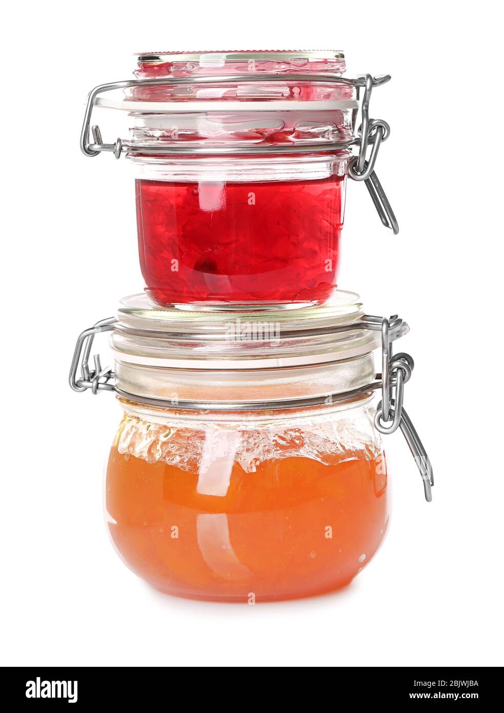 Jars with sweet jams on white background Stock Photo - Alamy