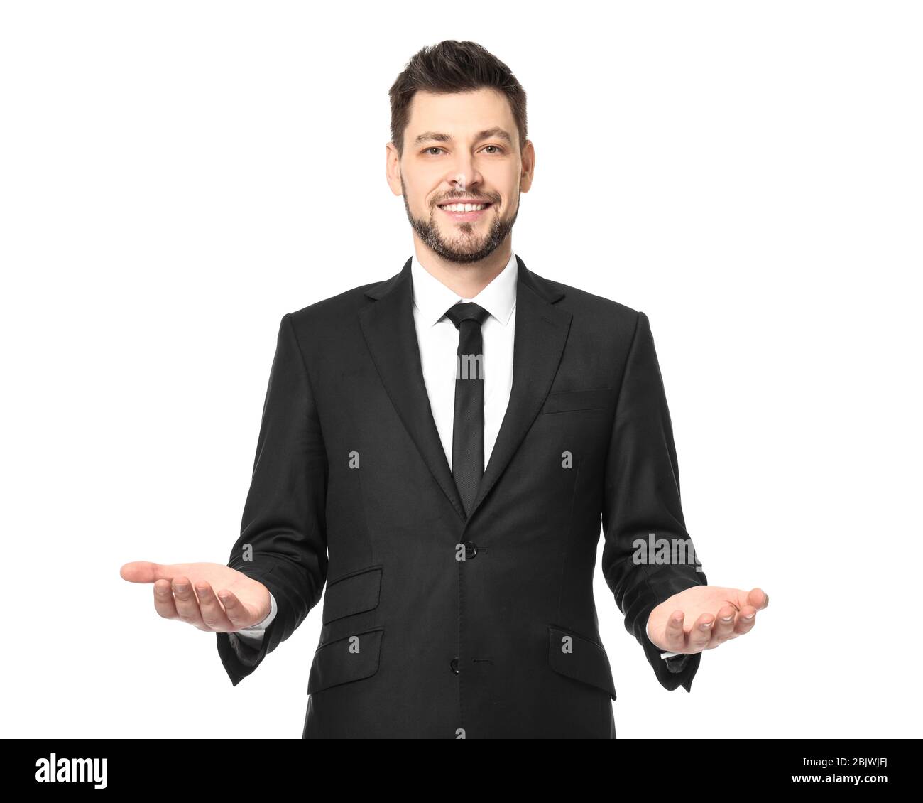 Young businessman showing balance gesture on white background Stock ...