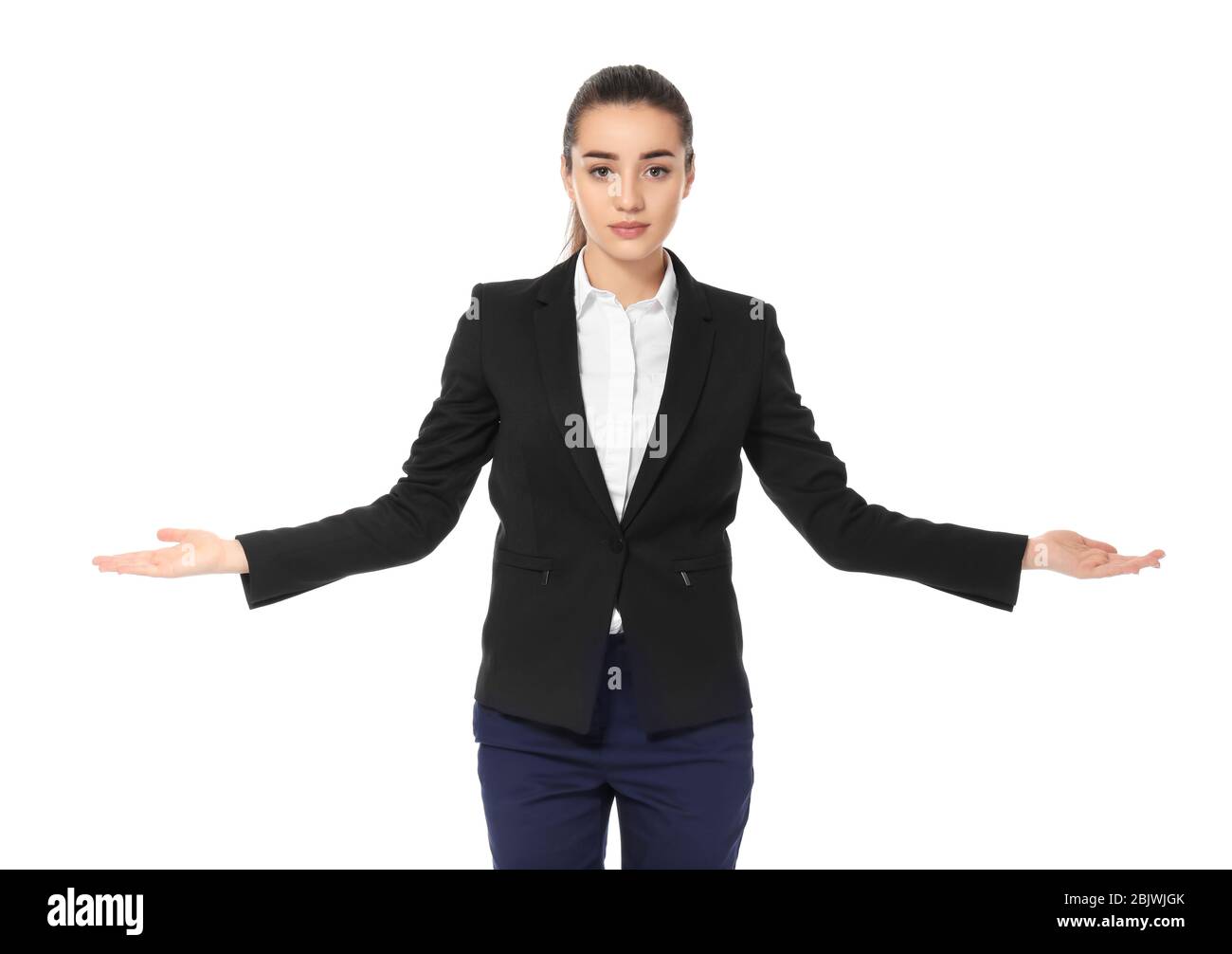 Young businesswoman showing balance gesture on white background Stock ...