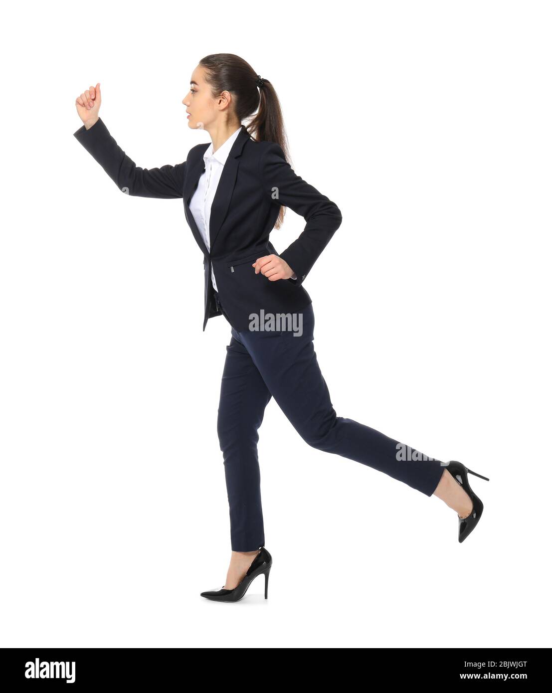 Young businesswoman running on white background Stock Photo - Alamy