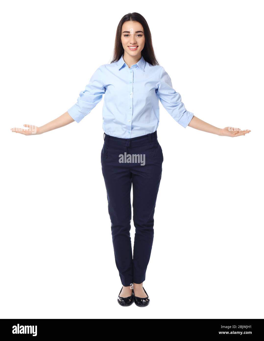 Young businesswoman showing balance gesture on white background Stock ...