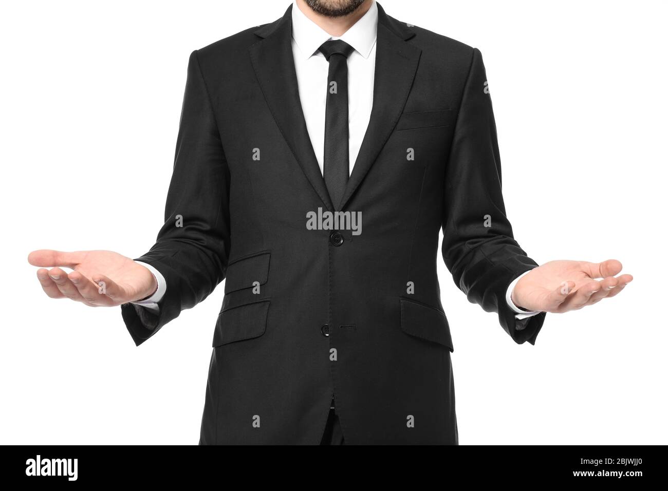 Young businessman showing balance gesture on white background Stock ...