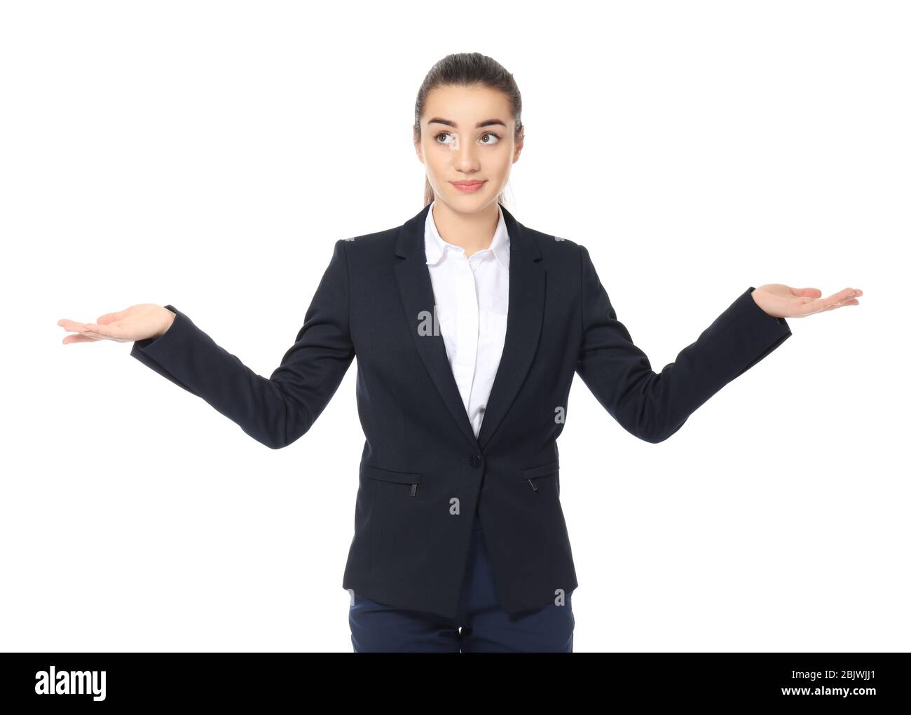 Young businesswoman showing balance gesture on white background Stock ...