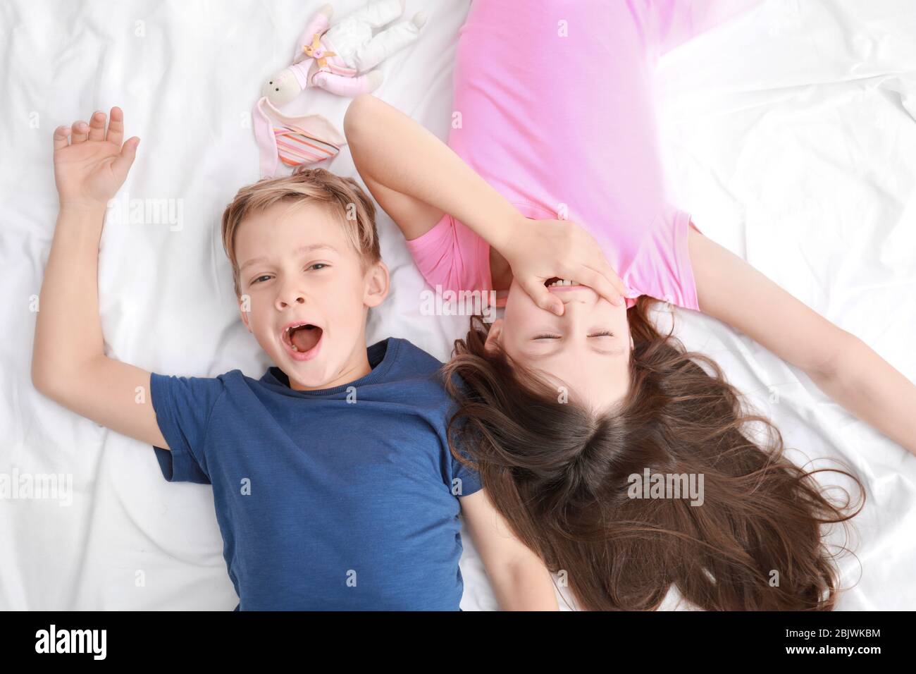 Cute little brother and sister waking up in bed Stock Photo - Alamy Cute little brother and sister waking up in bed Stock Photo - Alamy