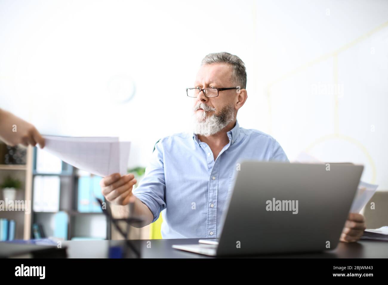 Bearded man working documents hi-res stock photography and images - Alamy