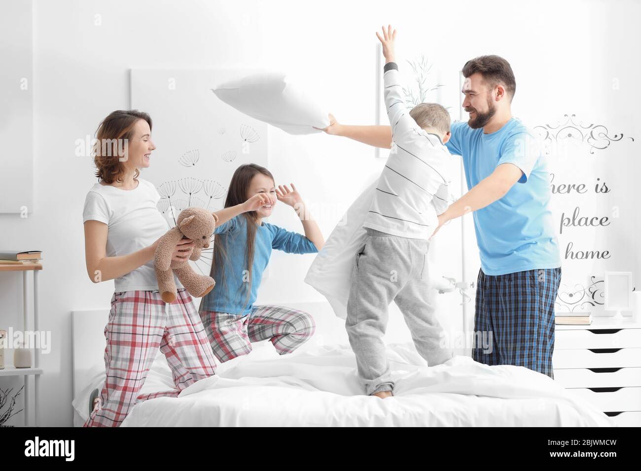 Morning of happy family having fun in bedroom Stock Photo - Alamy