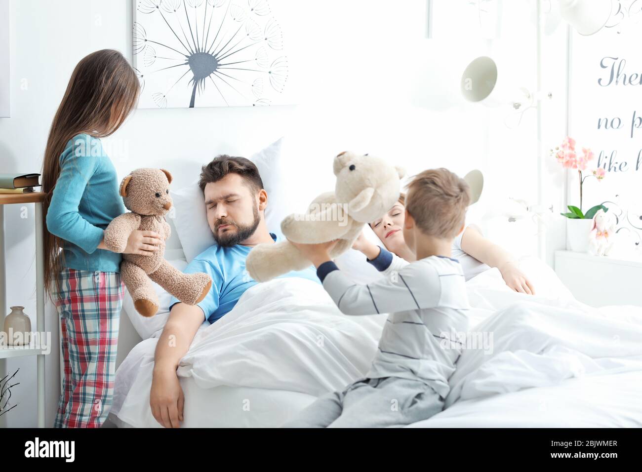 Son waking up father hi-res stock photography and images - Alamy