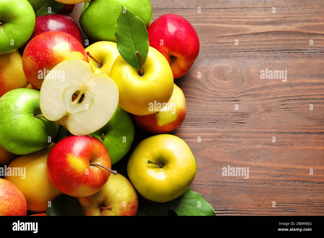 Ripe juicy apples on wooden table, top view Stock Photo - Alamy