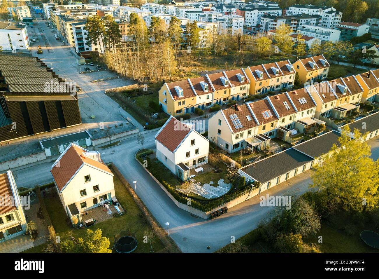 Aerial view of residential houses with red roofs and streets with ...