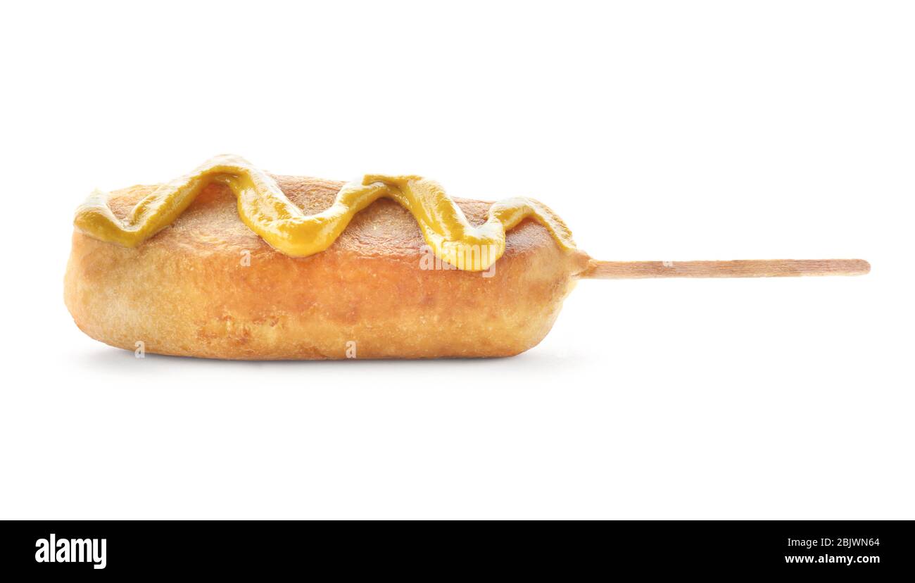 Tasty corn dog with mustard on white background Stock Photo - Alamy