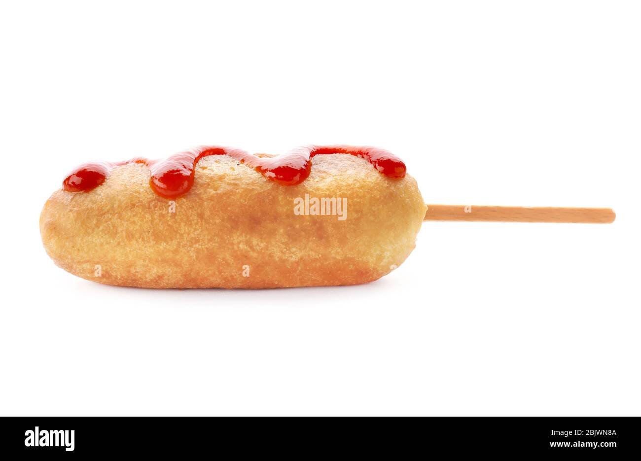 Tasty corn dog with ketchup on white background Stock Photo - Alamy