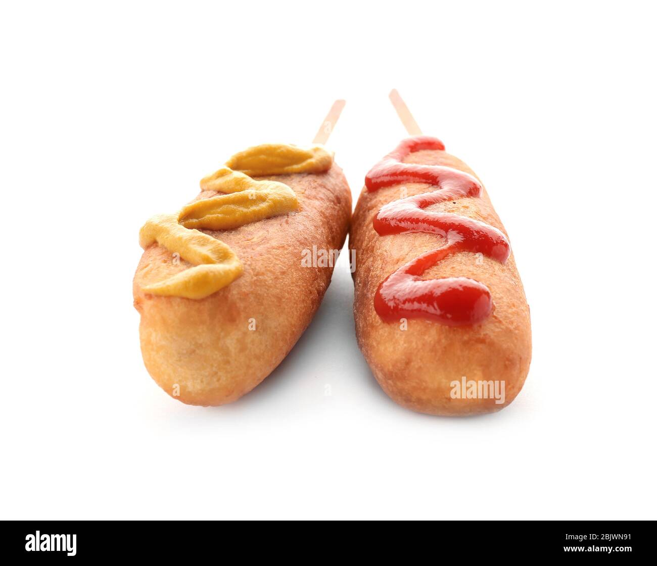 Tasty corn dog with ketchup and mustard on white background Stock Photo ...