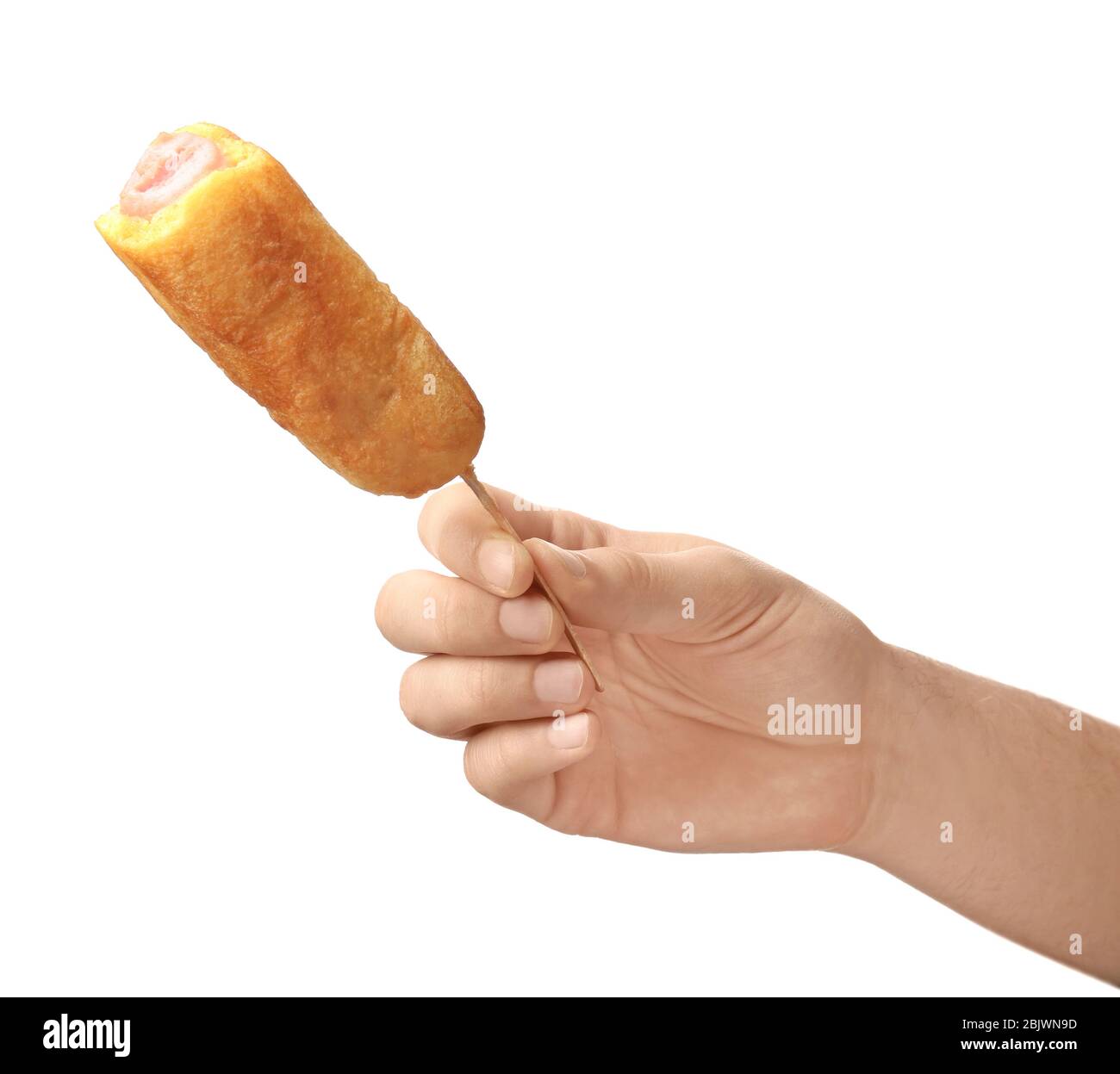 Woman holding tasty corn dog on white background Stock Photo - Alamy
