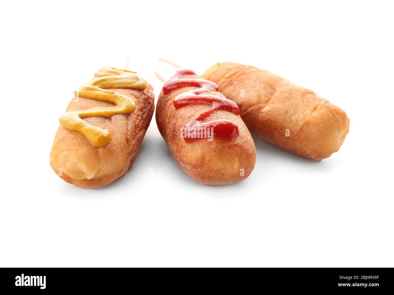 Tasty corn dog with ketchup and mustard on white background Stock Photo ...