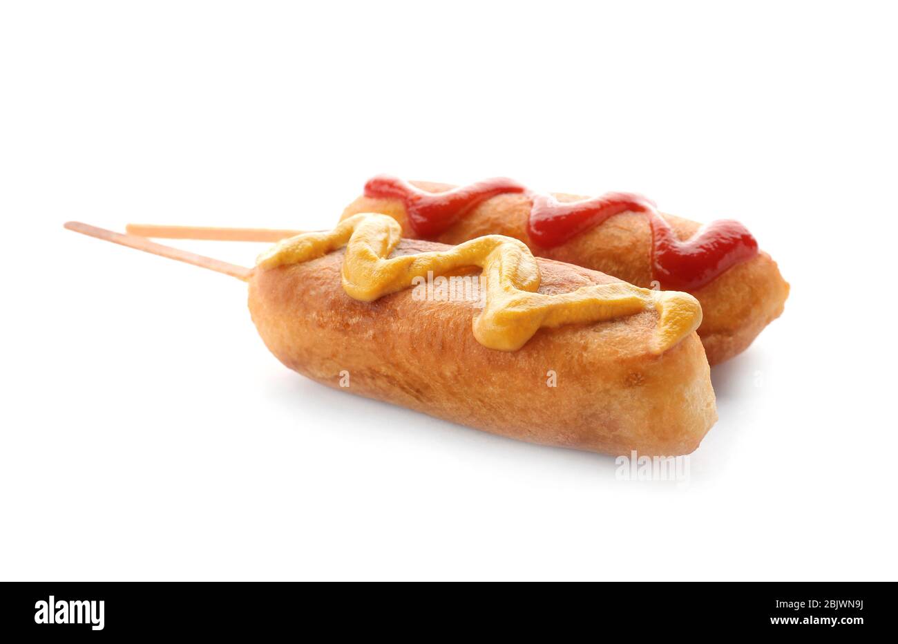 Tasty corn dog with ketchup and mustard on white background Stock Photo ...