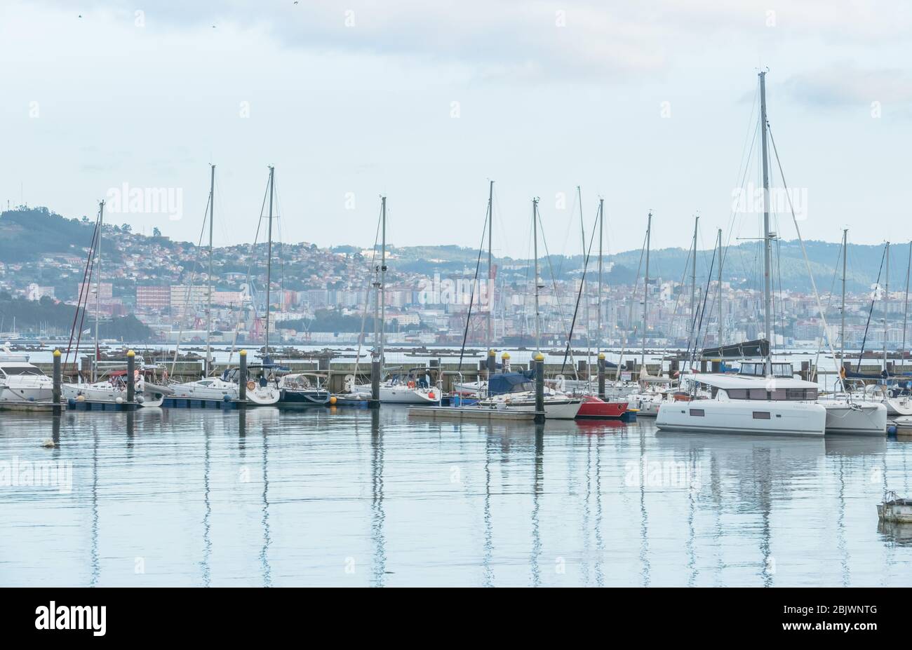 nautical port with city as background in Spain Stock Photo - Alamy