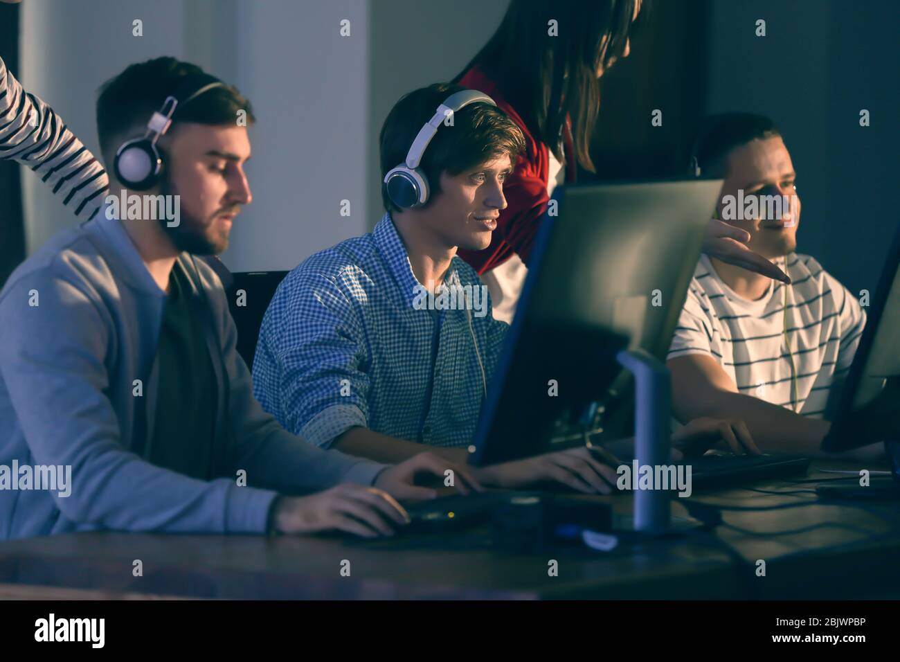 Young people playing video games at tournament Stock Photo - Alamy