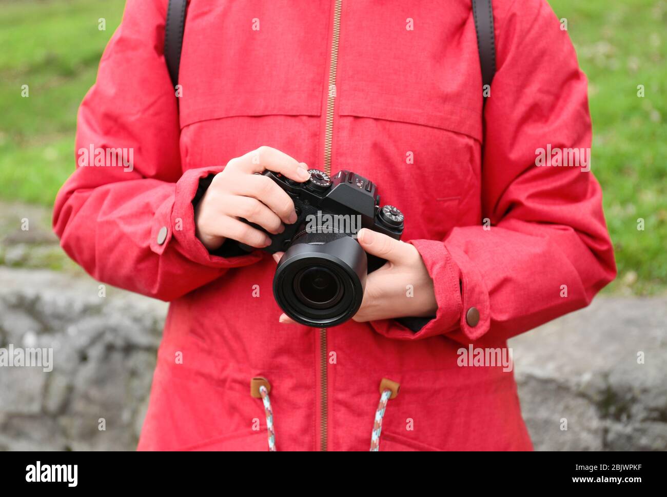 Young photographer with camera, outdoors Stock Photo - Alamy