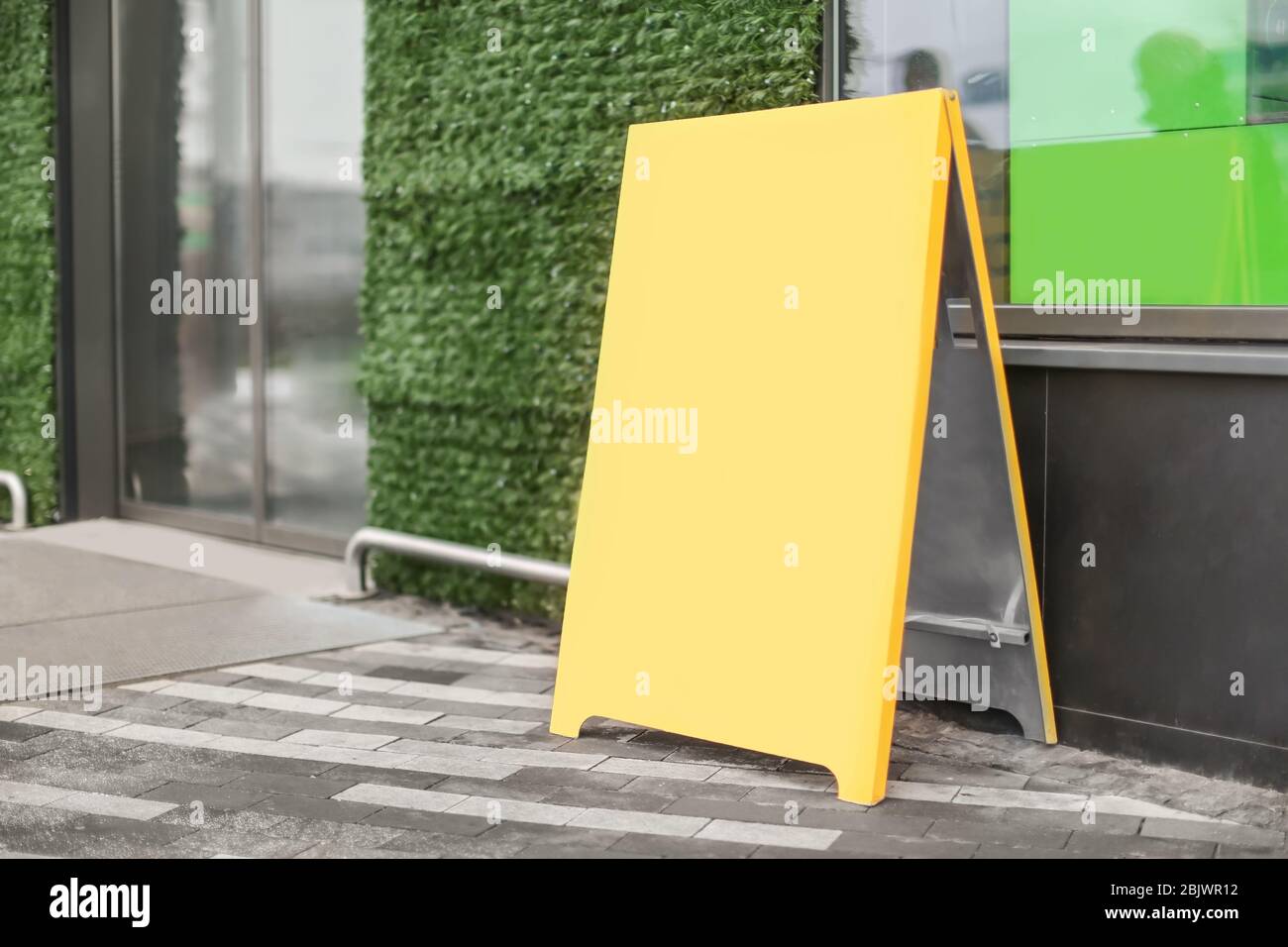 Advertising board on city street Stock Photo - Alamy