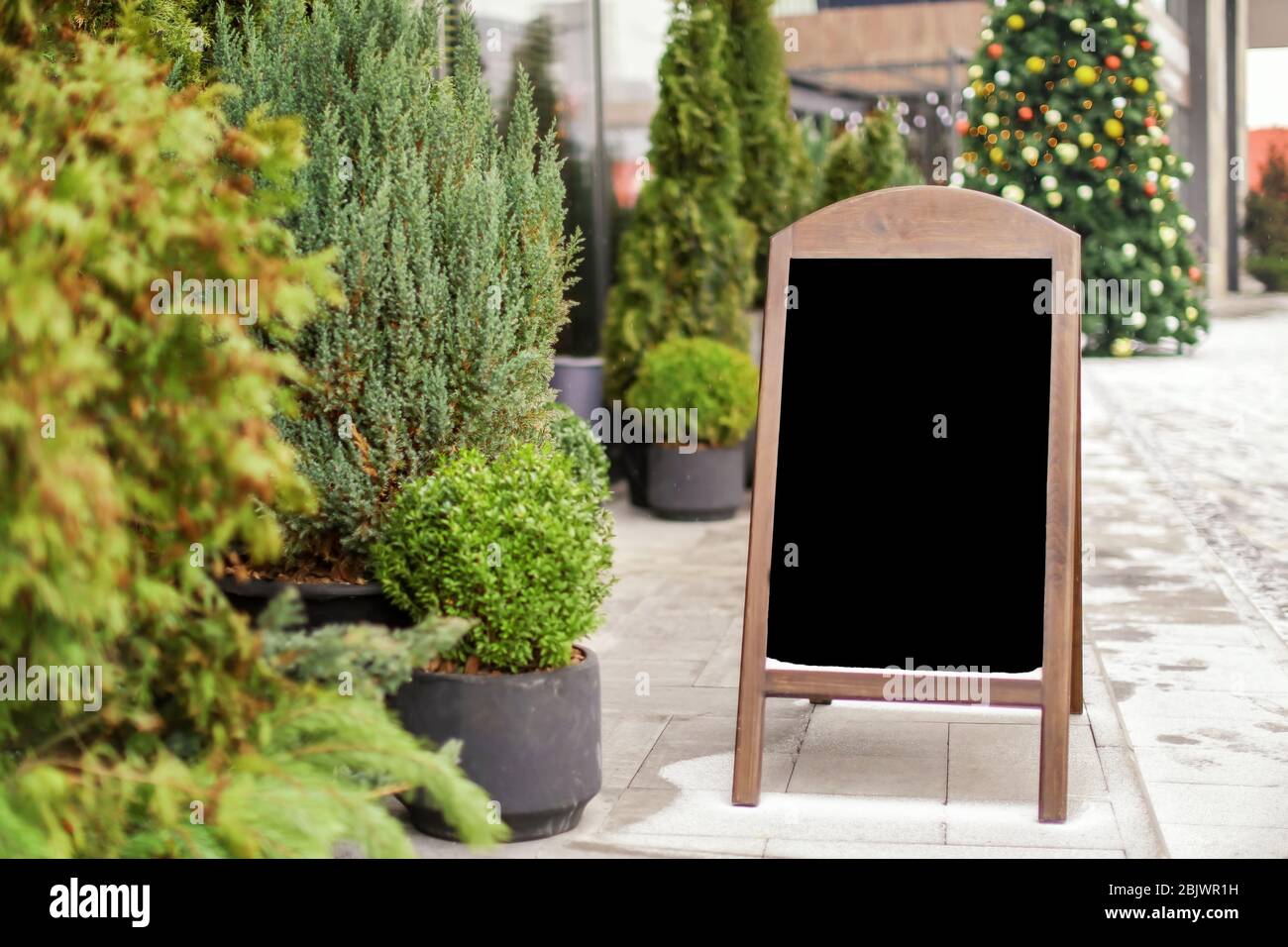 Advertising board on city street Stock Photo - Alamy