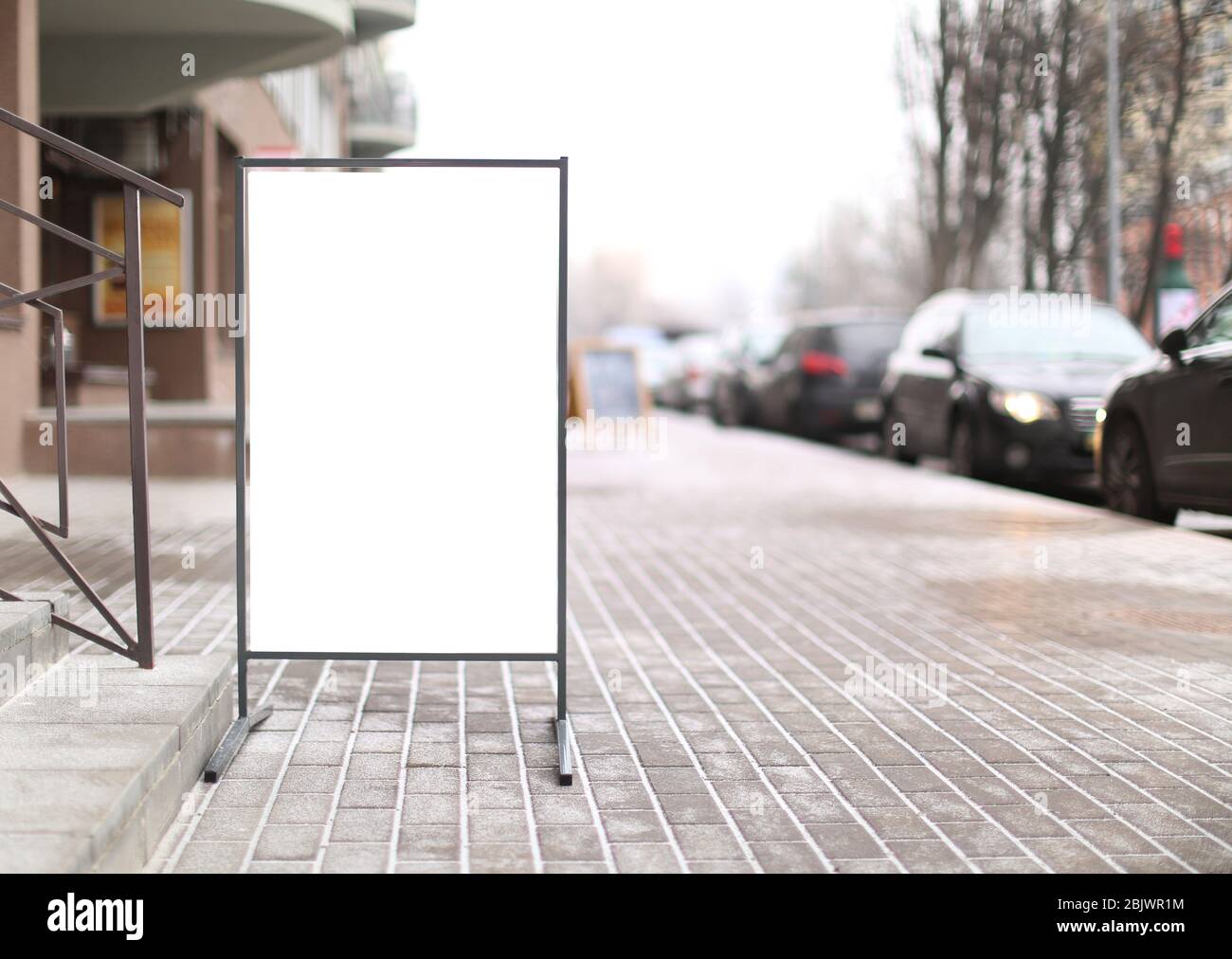 Advertising board on city street Stock Photo - Alamy
