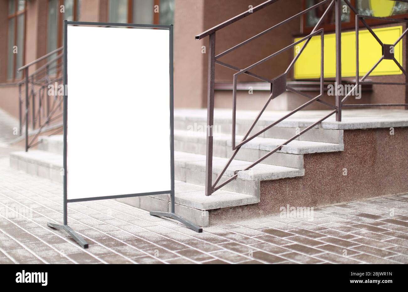 Advertising board on city street Stock Photo - Alamy