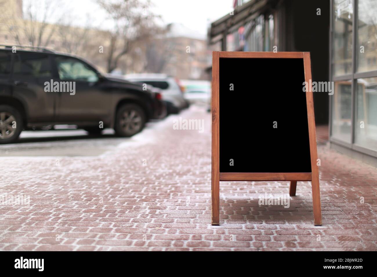 Advertising board on city street Stock Photo - Alamy