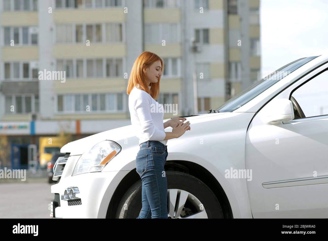 Girl stand near white car hi-res stock photography and images - Alamy