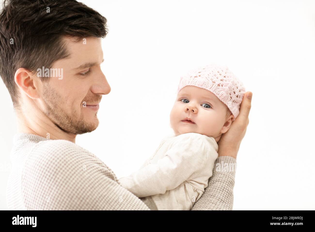 Young father with baby on white background Stock Photo - Alamy
